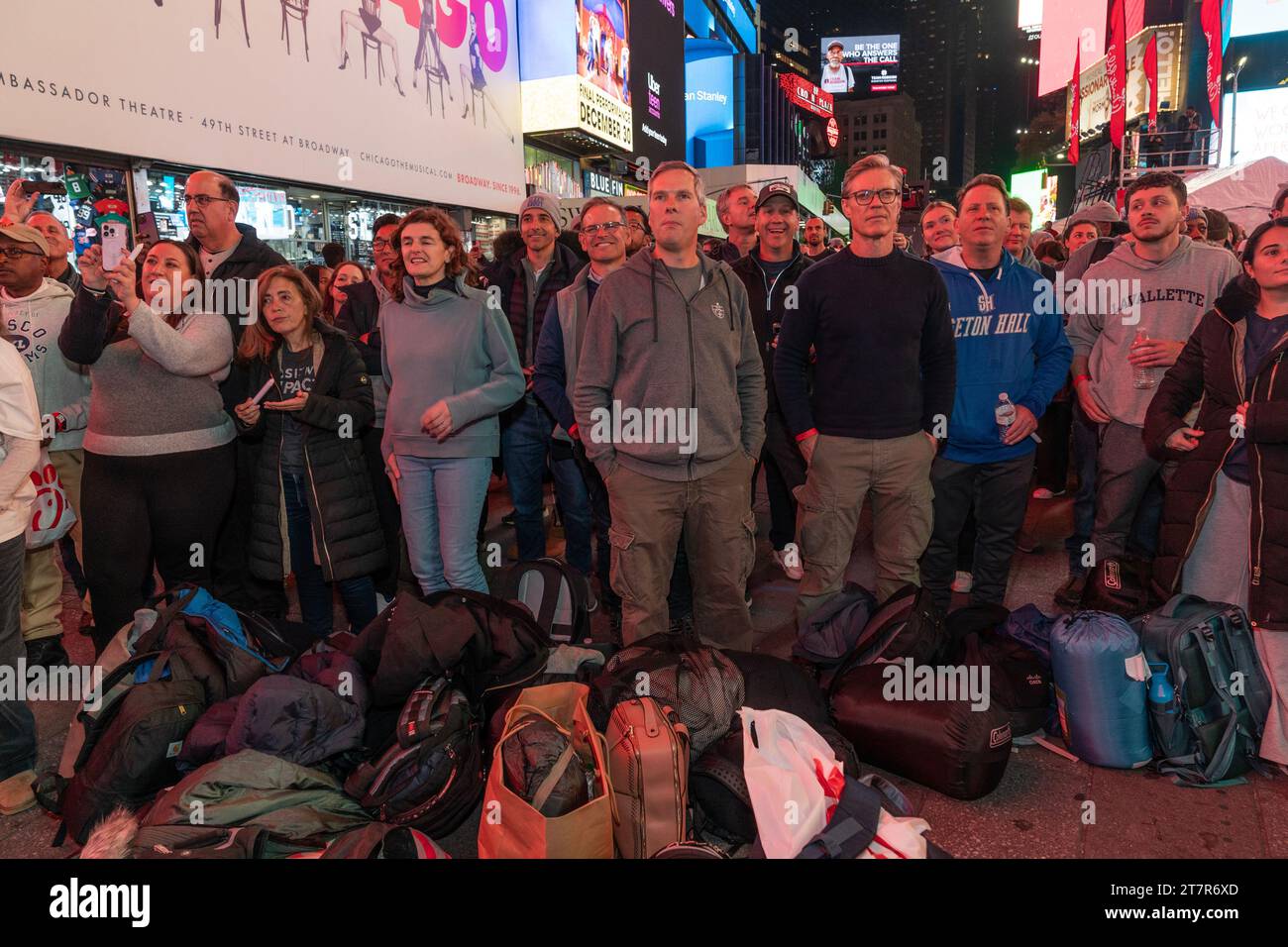 People attend sleep out night on Times Square in New York on November ...