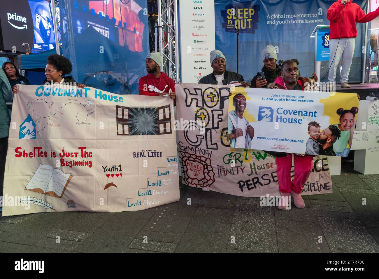 People attend sleep out night on Times Square in New York on November ...