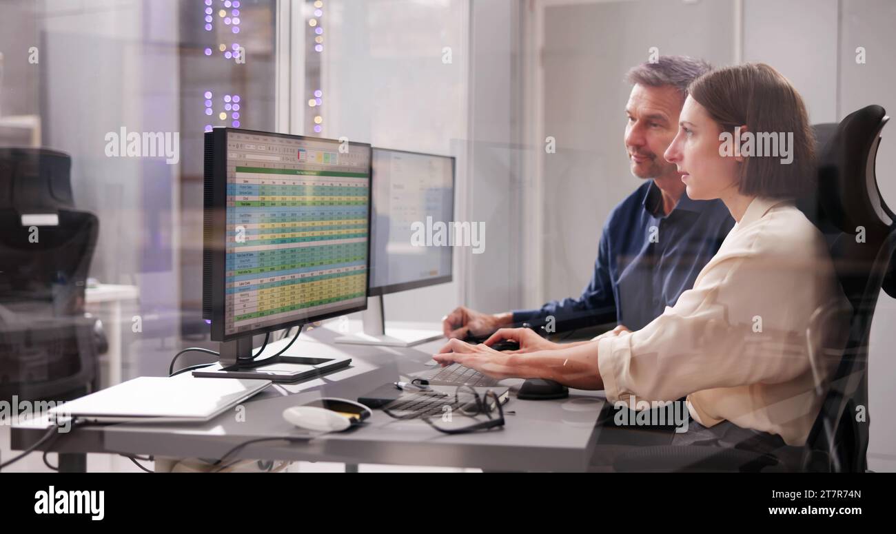 Working Analyst on Desktop Computer with Spreadsheets Stock Photo - Alamy