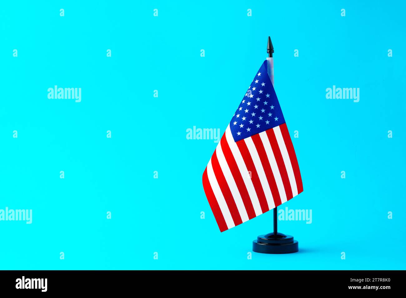 Small flag of USA on flagpole on studio background Stock Photo - Alamy