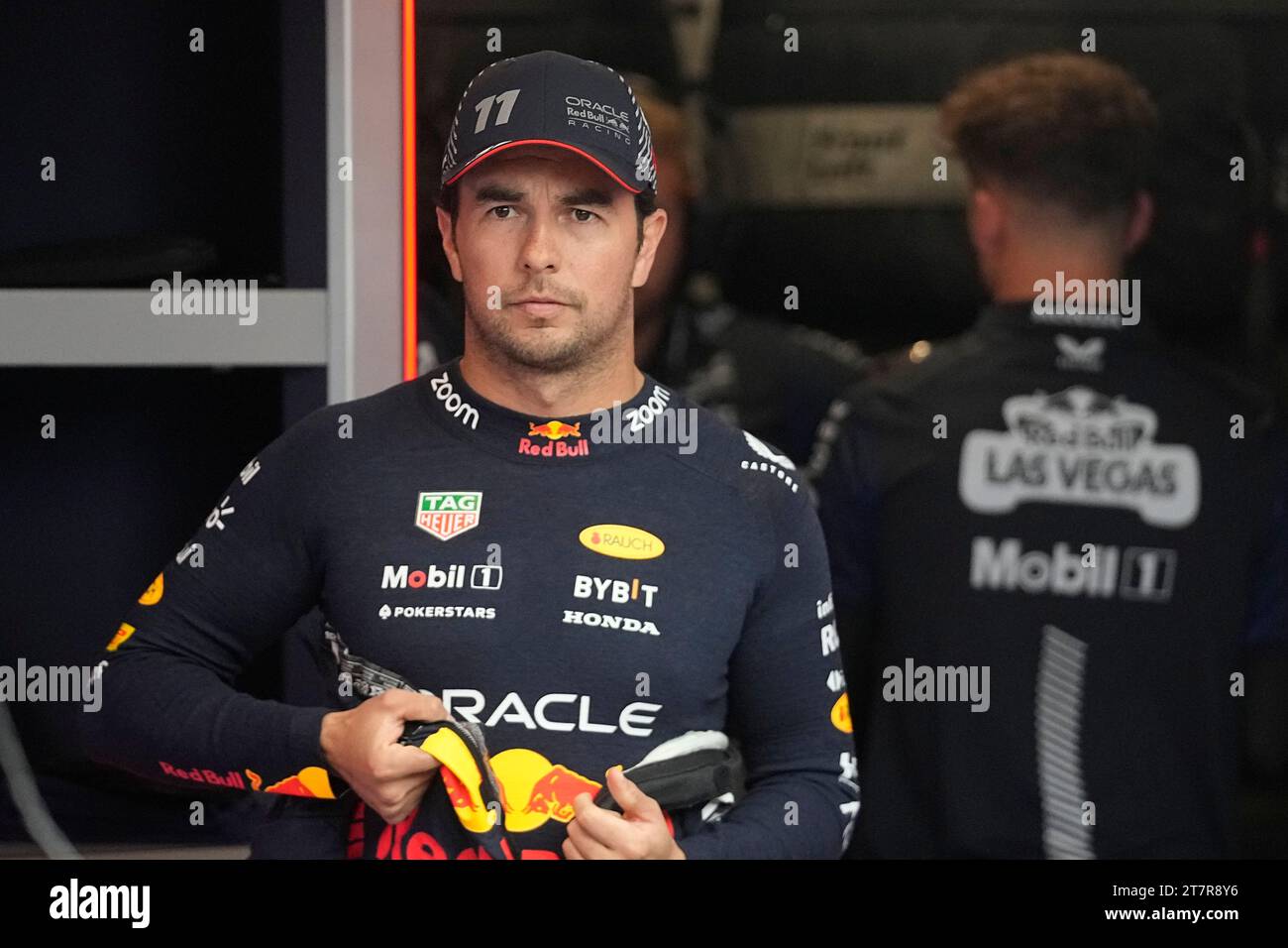 Red Bull driver Sergio Perez, of Mexico, waits in the garage before the ...