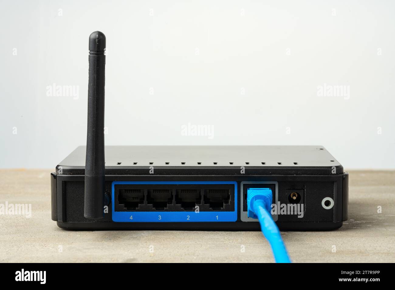 Modern router with cables plugged in close up Stock Photo - Alamy