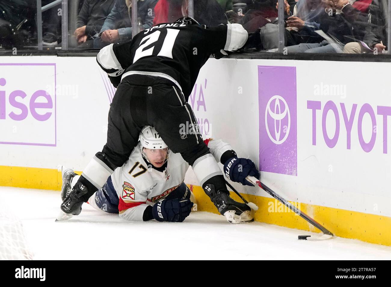 Florida Panthers center Evan Rodrigues, below, reaches for the puck ...