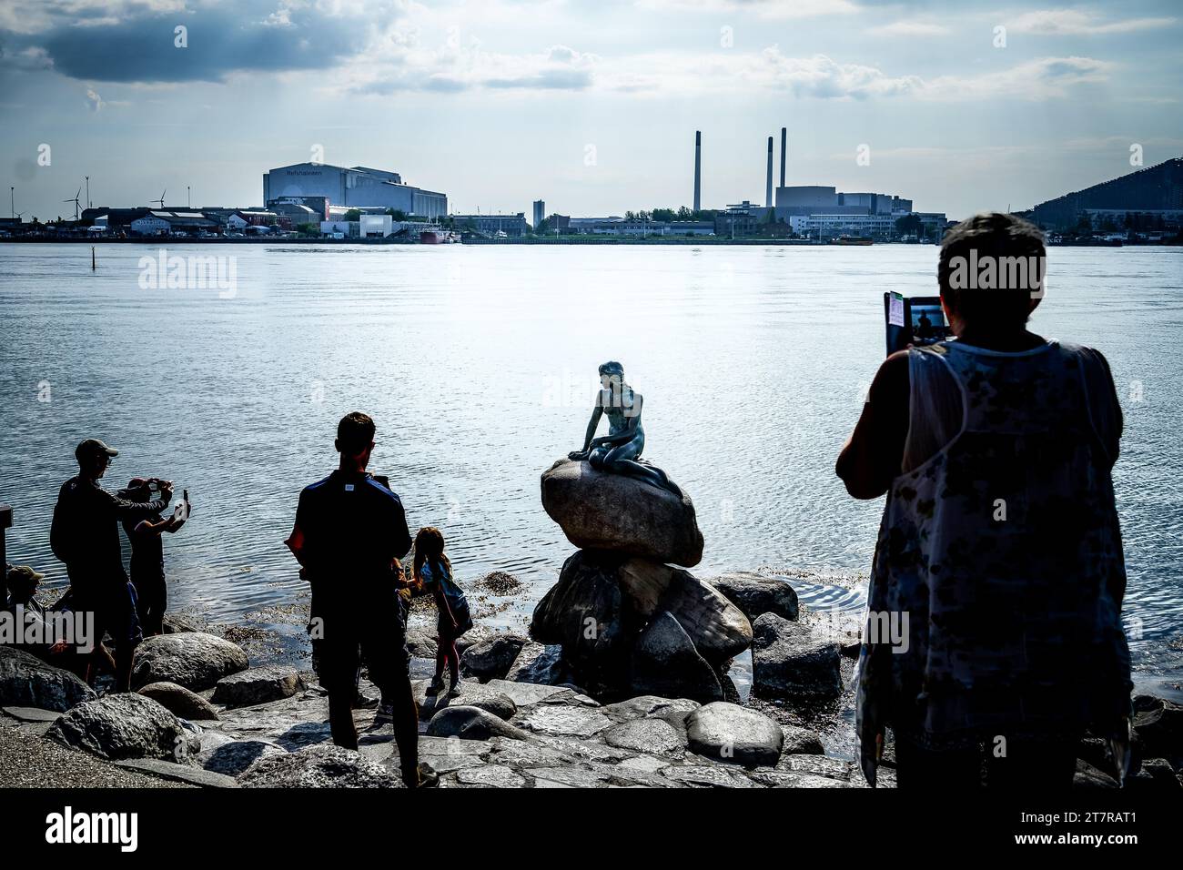 Tourists photographing The Little Mermaid sculpture Edvard Eriksen (1913).Copenhagen Denmark ...