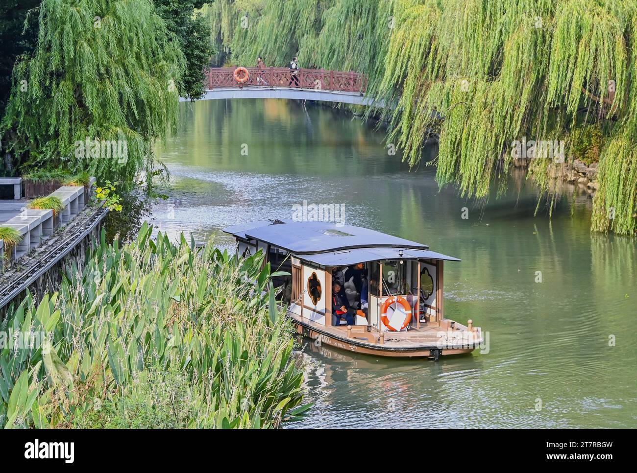 Tourists take a water bus to enjoy autumn scenery in Hangzhou City ...