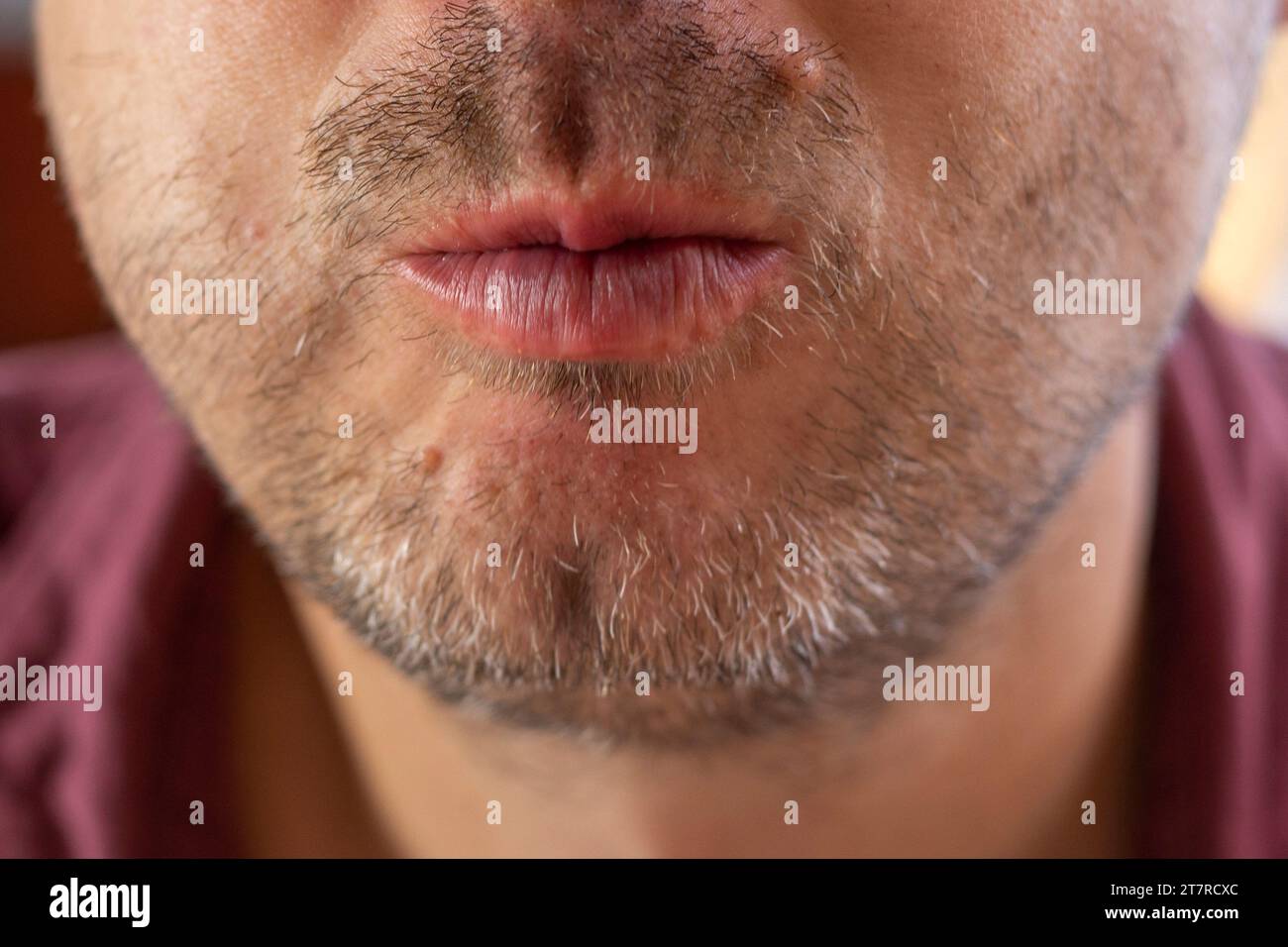 man chews a piece of homemade cucumber with his mouth closed Stock ...