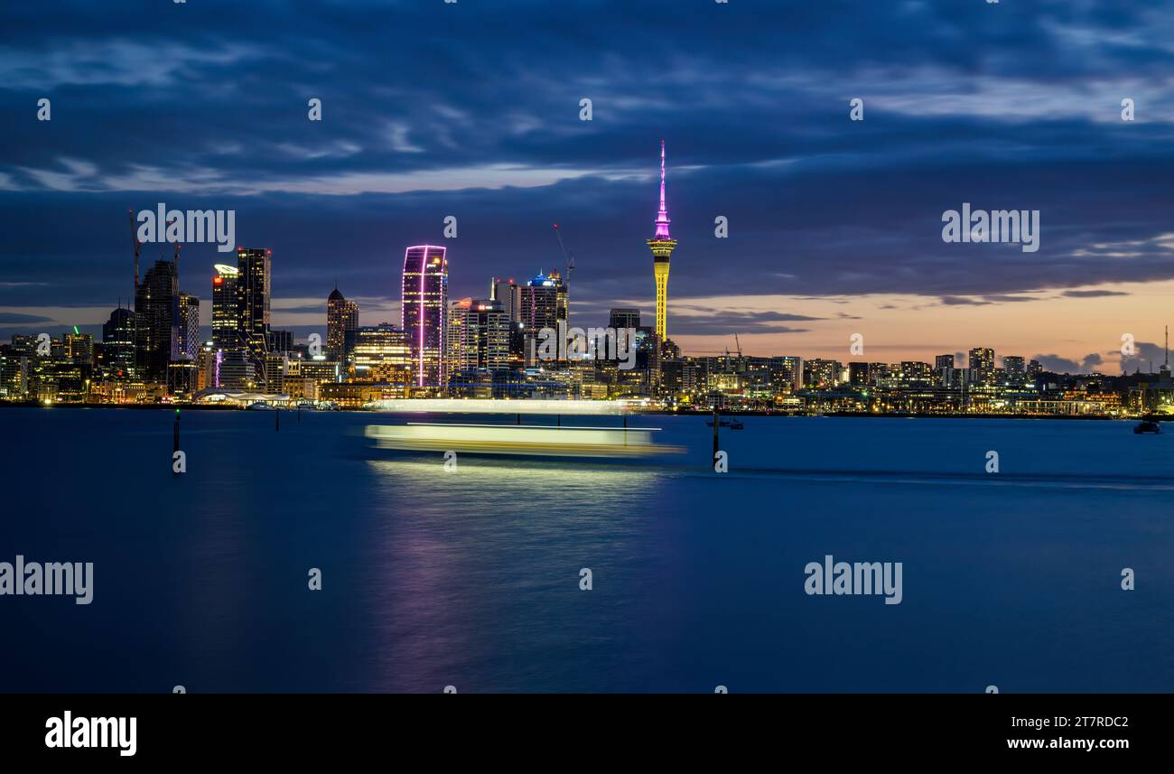Sky Tower lit up in pink and yellow to celebrate Diwali. Long exposure ...
