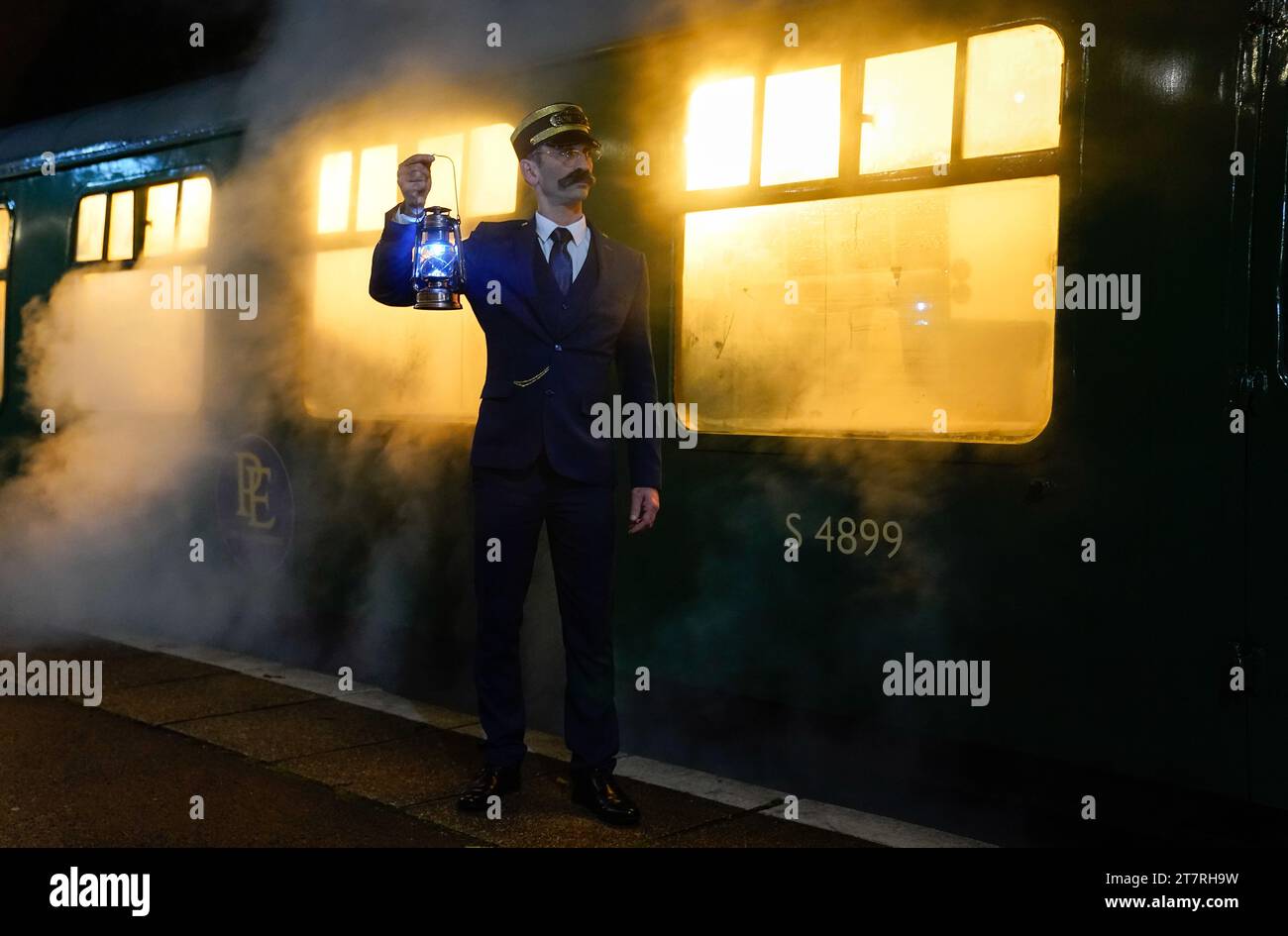 An actor playing the role of the Conductor, poses for a photograph ...