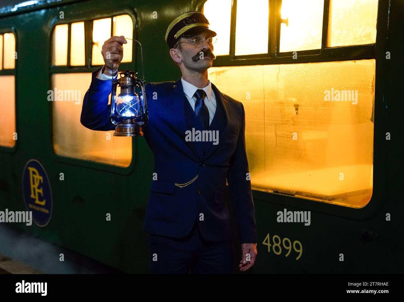 An actor playing the role of the Conductor, poses for a photograph ...