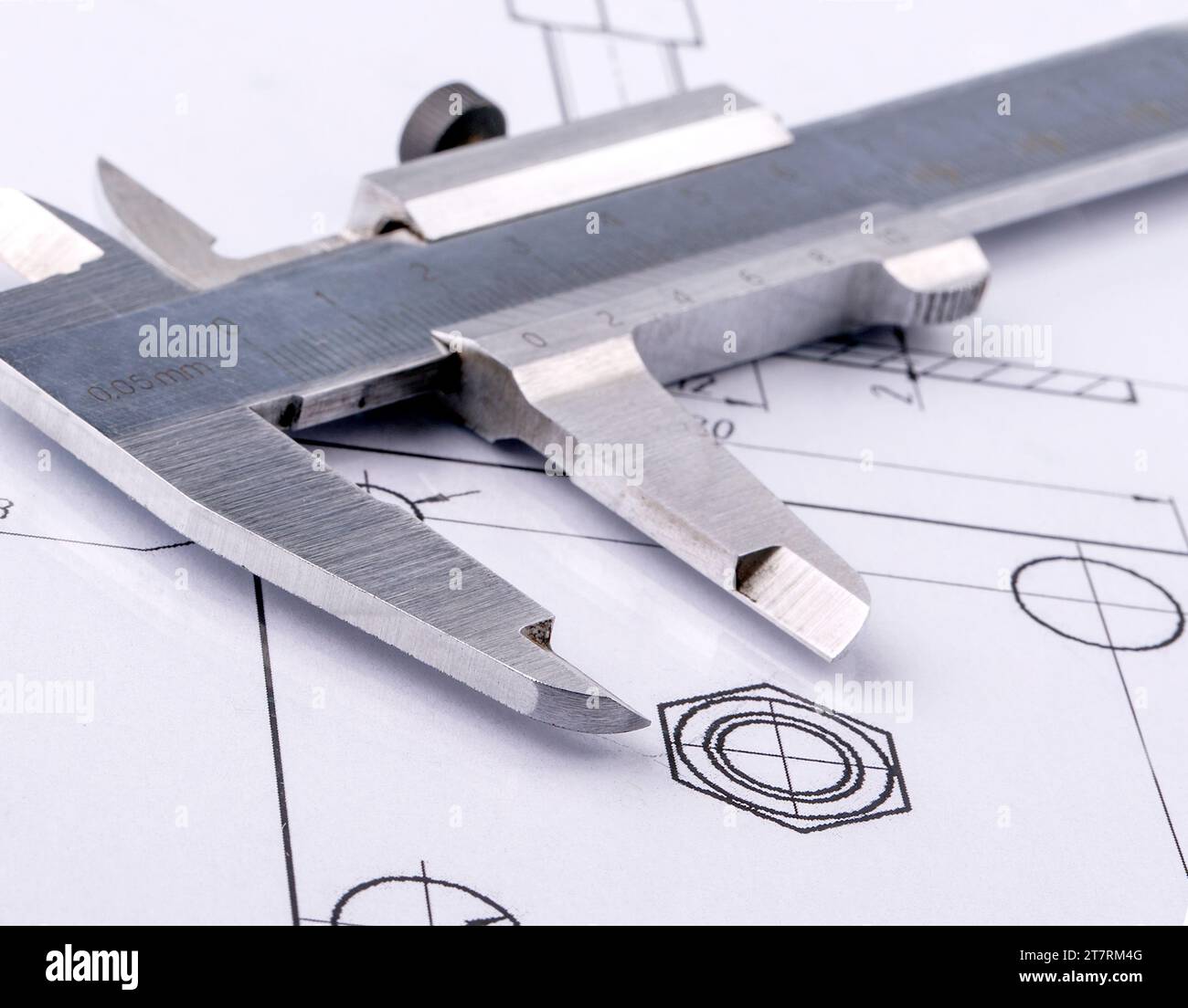 The Old metal caliper and engineering drawing. Close up Stock Photo - Alamy