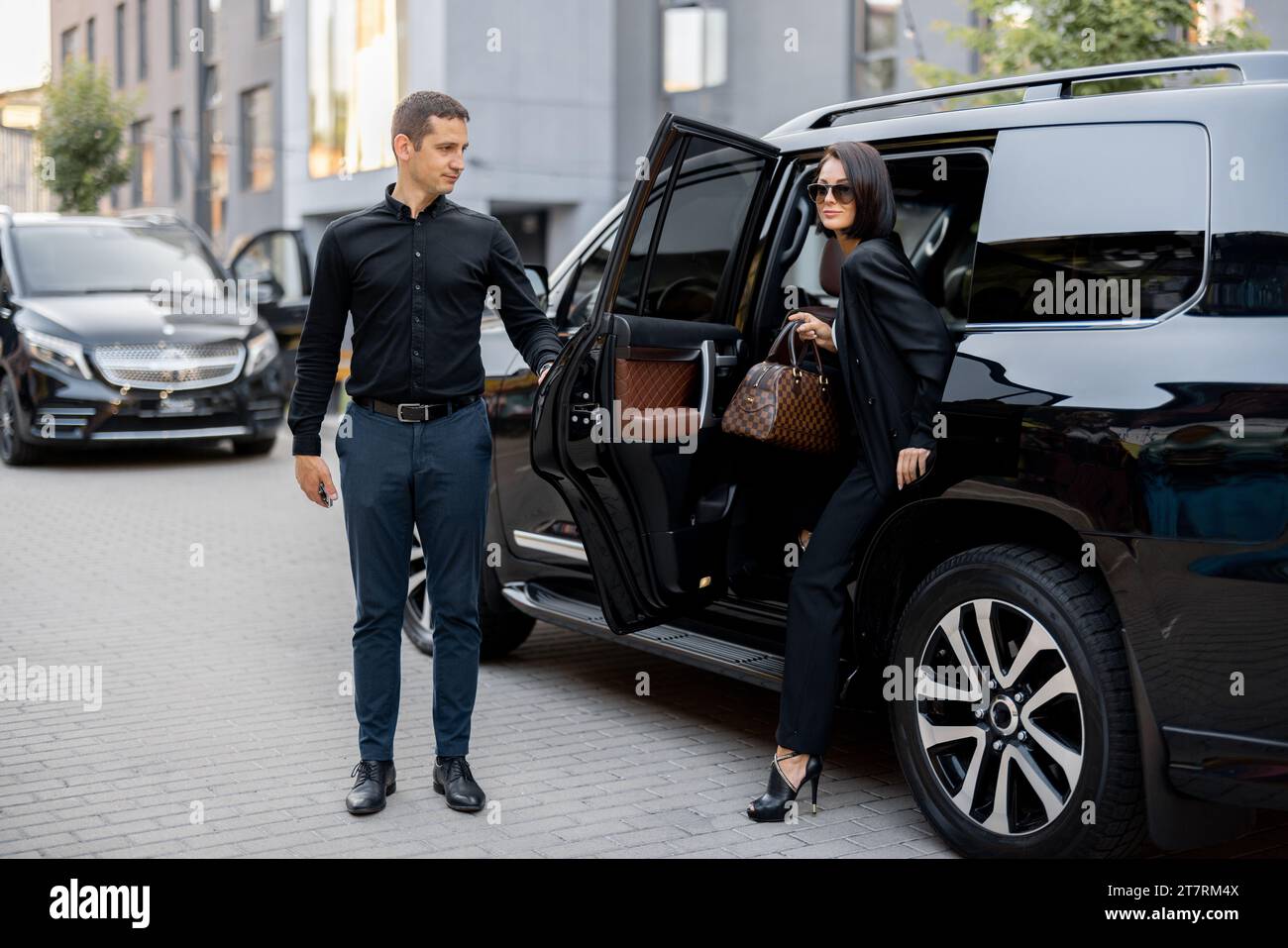 The rich woman with chauffeur hi-res stock photography and images - Alamy