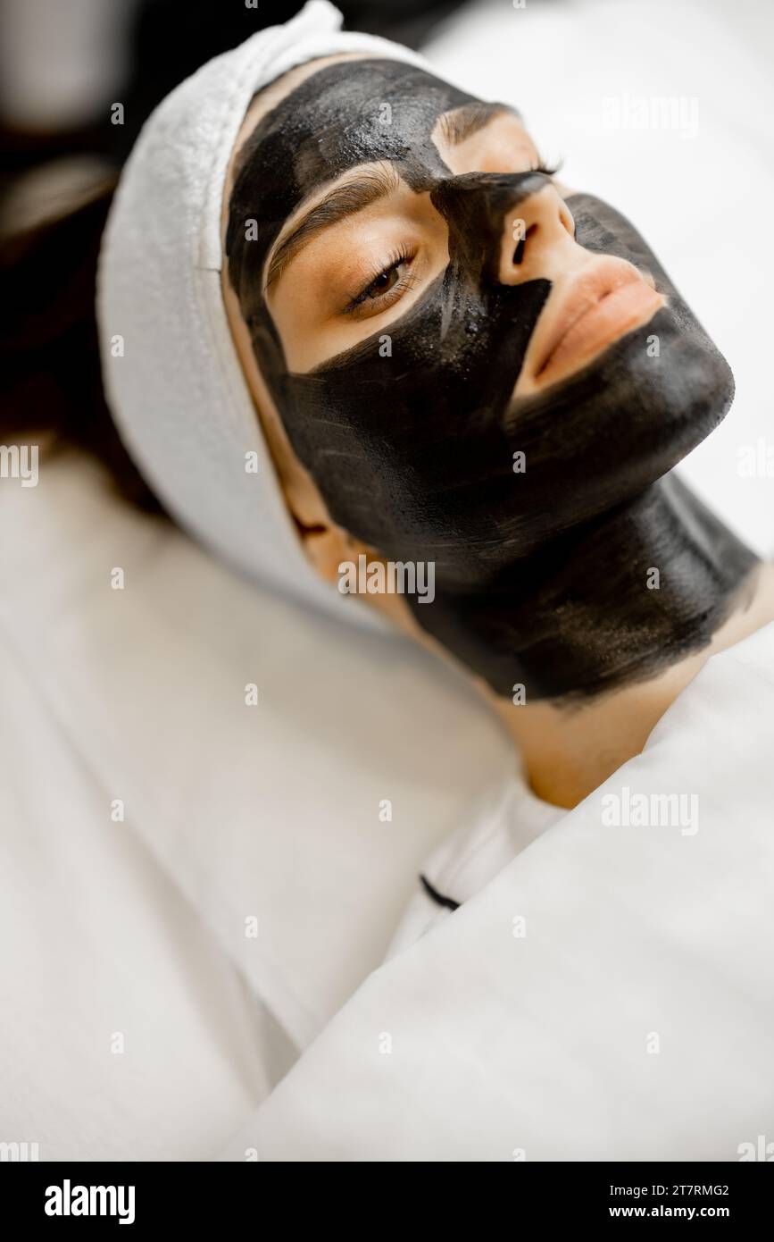 Young woman's face in carbon mask ready for laser peeling Stock Photo ...