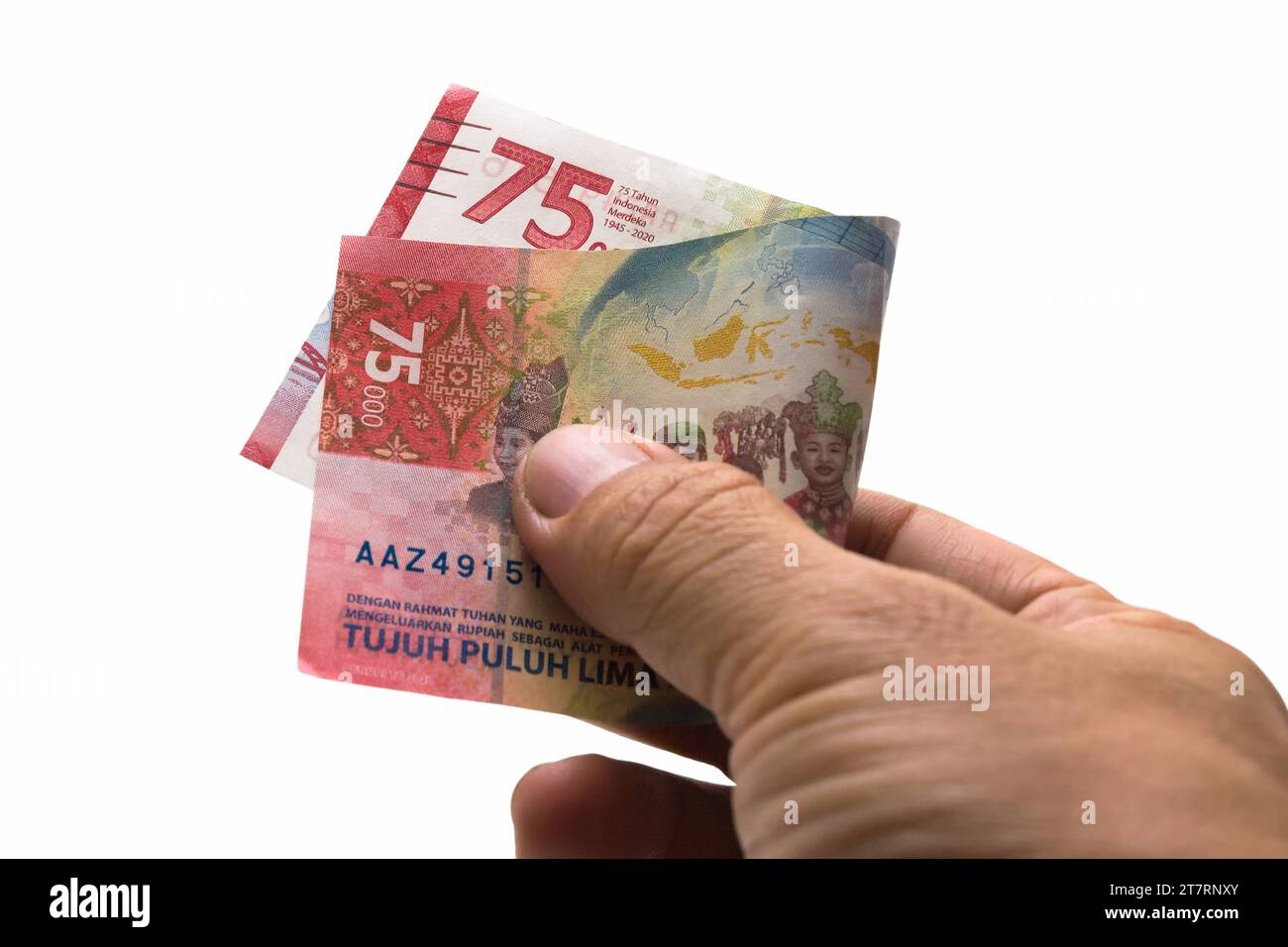 Mans hand holding rupiah hi-res stock photography and images - Alamy