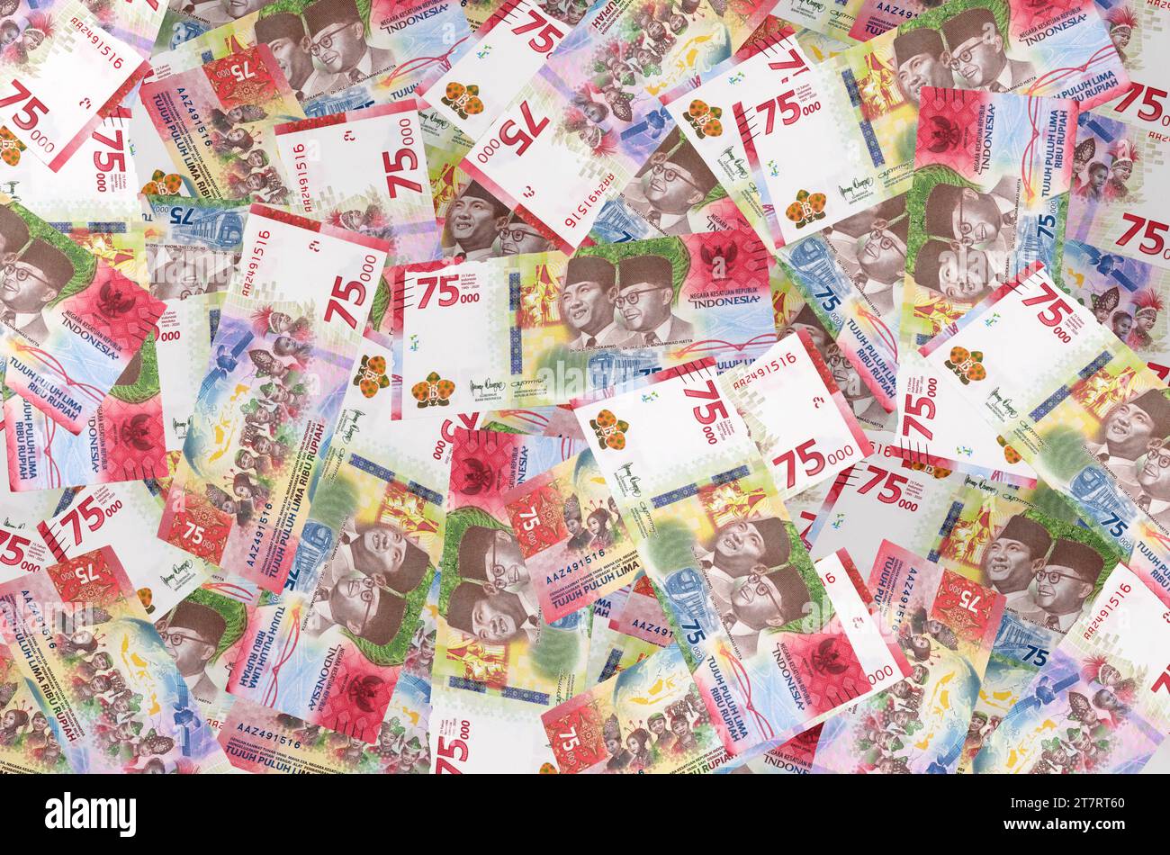 Background of 75,000 Rupiah banknotes, a group of Indonesian 75,000 ...