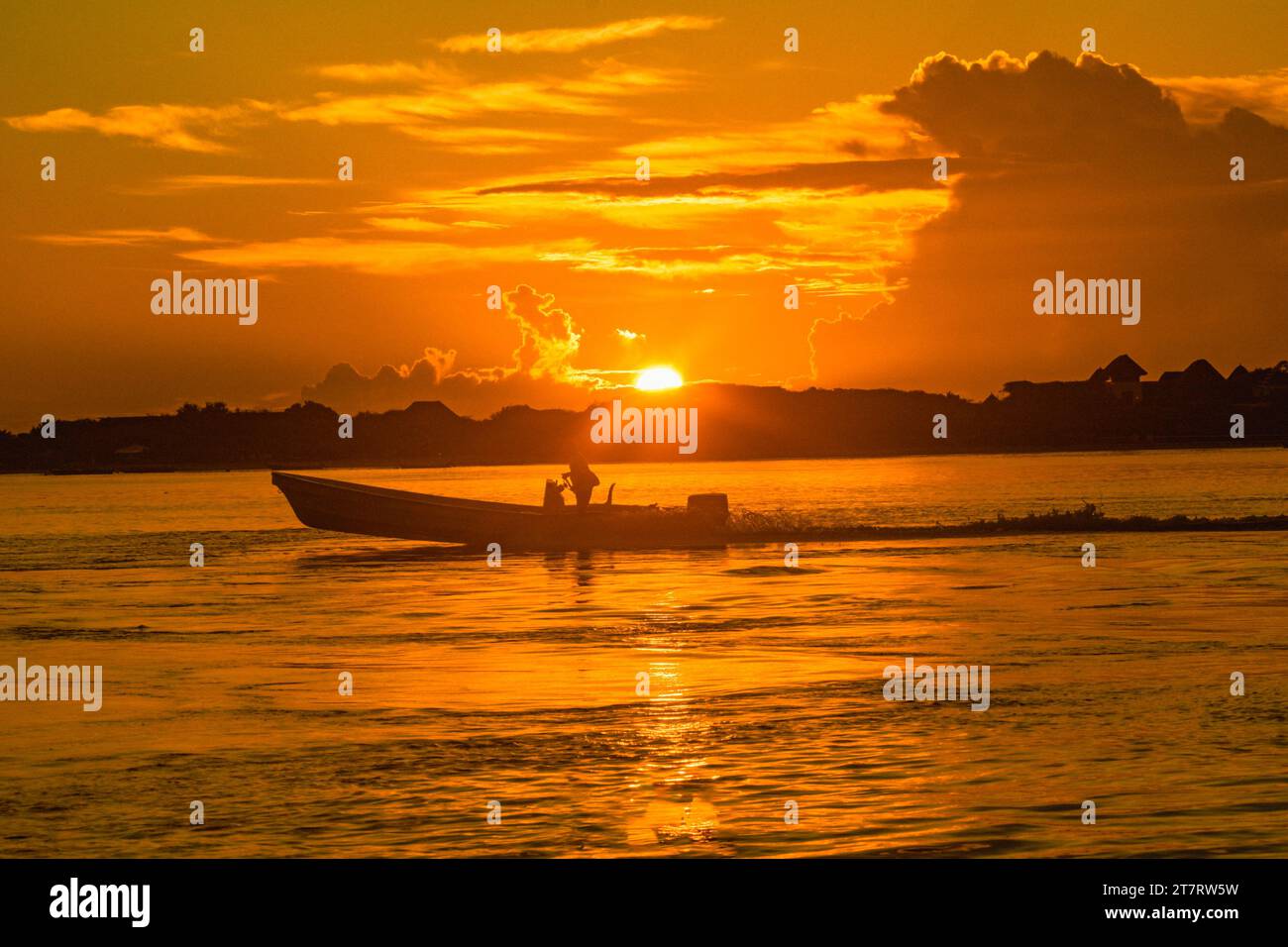 Silhoutte of fishing boats at sunset at Shela Beach in Old Town Lamu ...