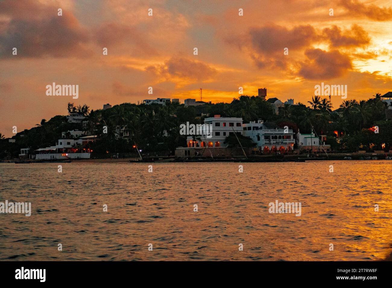 Silhouette of Shela Baech waterfront at sunset in Old Town Lamu, UNESCO ...