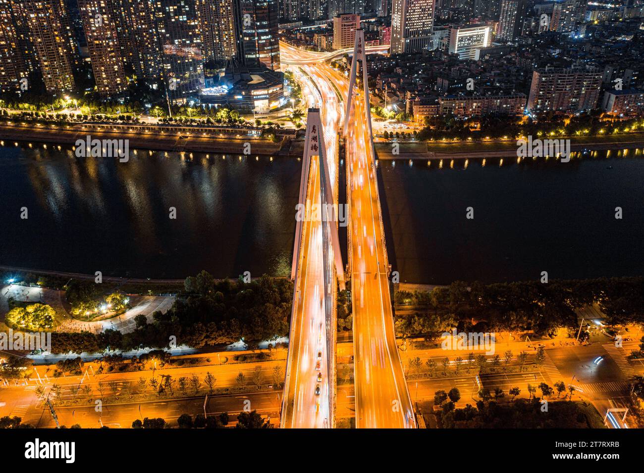 A night view aerial shot of a group of tall buildings along the Han ...