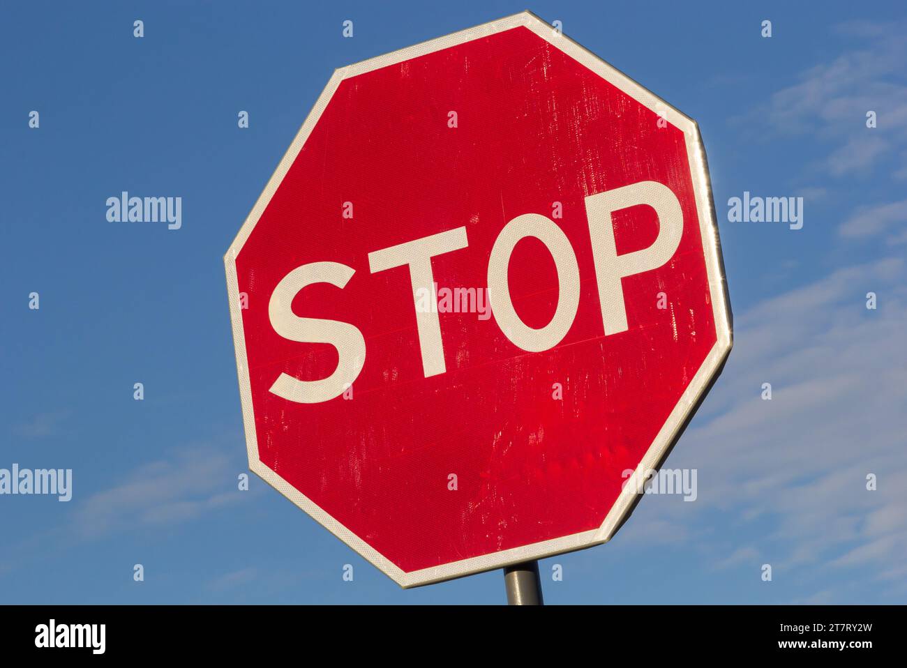 Red Stop Sign with Blue Sky and Clouds Background Stock Photo - Alamy