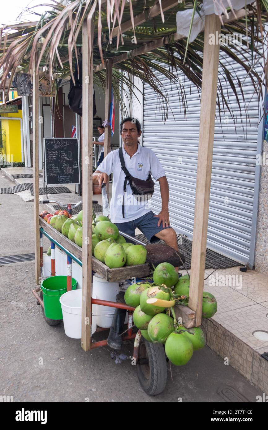 Street vendor of coconuts on a street in the town of Tortuguero in Costa Rica Stock Photo - Alamy