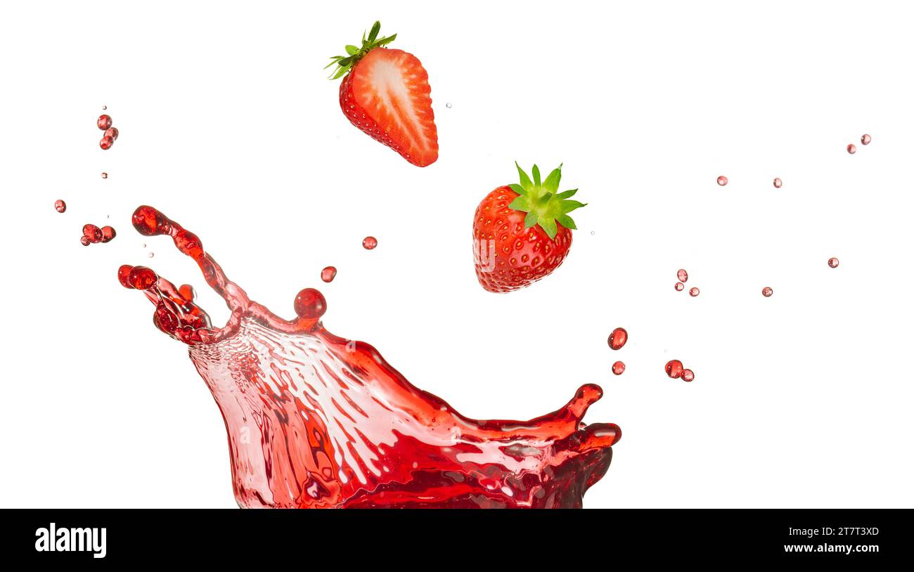 Ripe strawberries falling into a transparent red liquid crown shaped ...