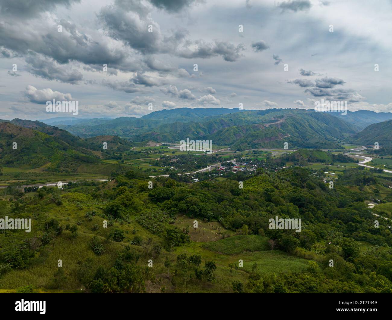 Tropical mountain range covered rainforest. Blue sky with clouds ...
