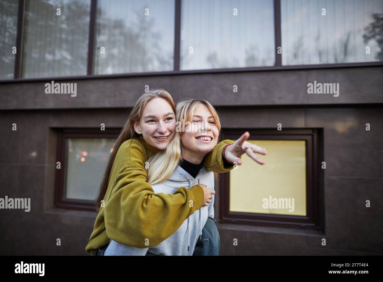 smiling teens carrying friend piggyback Stock Photo - Alamy smiling teens carrying friend piggyback Stock Photo - Alamy