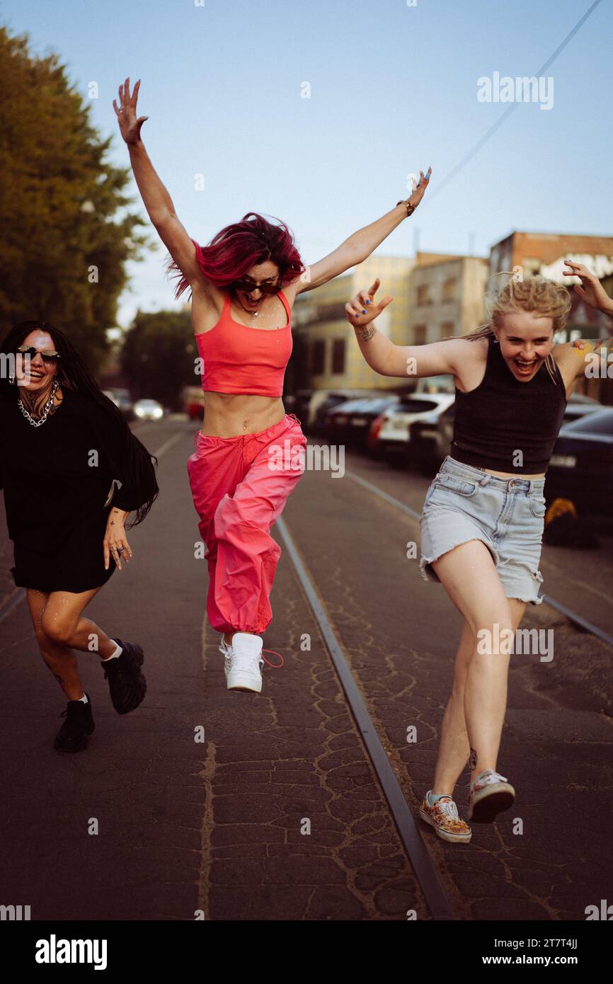Three happy women friends at sunset, emotional portrait, friendship ...