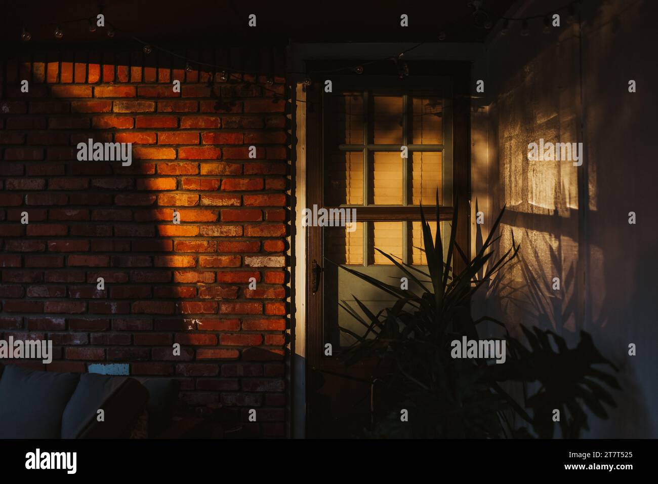 Sunset on side of building with sun reflecting on windows Stock Photo ...