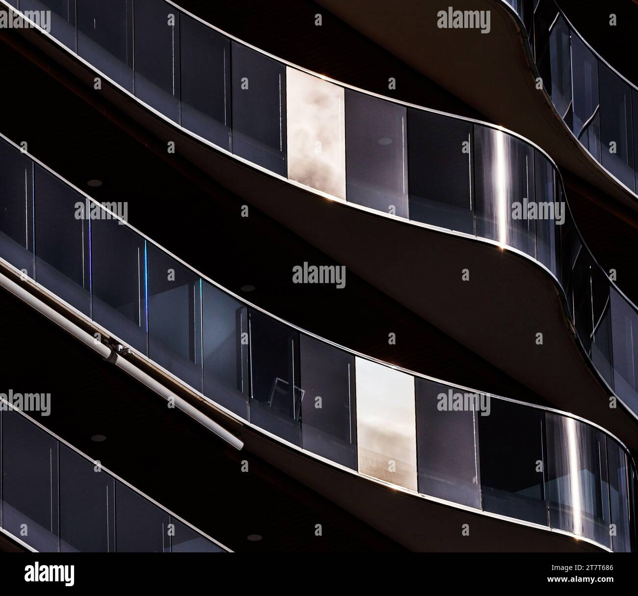reflections on the wave-shaped balconies Stock Photo - Alamy