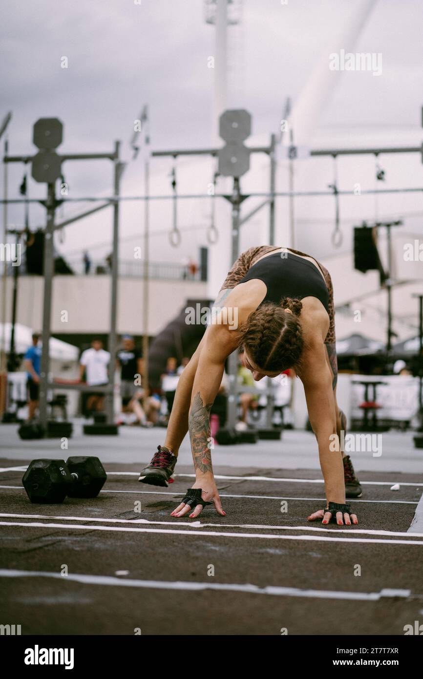A woman does burpees and push-ups at a CrossFit competition Stock Photo ...
