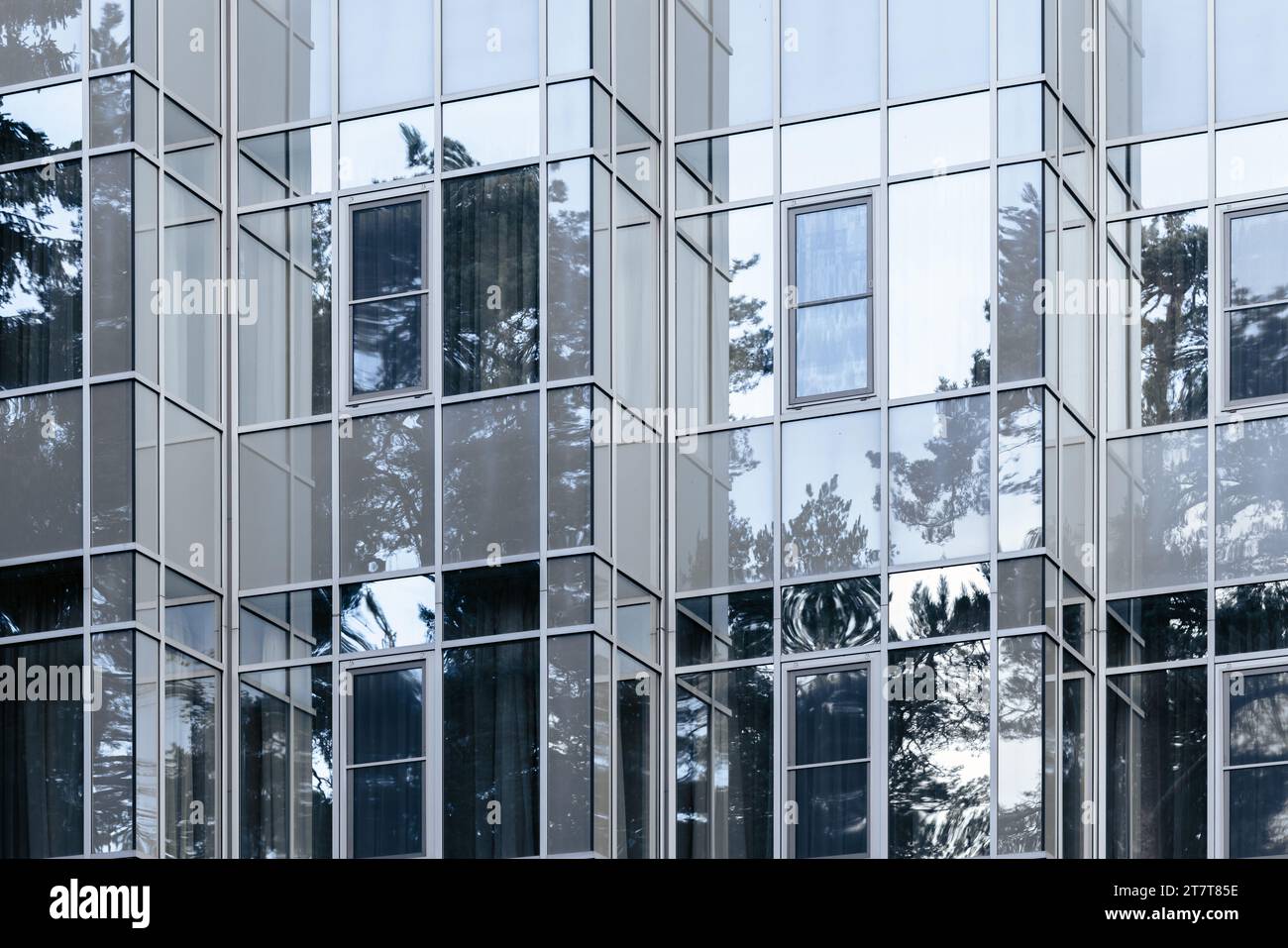 Abstract modern architecture details, urban facade made of steel framework and shiny glass with ...