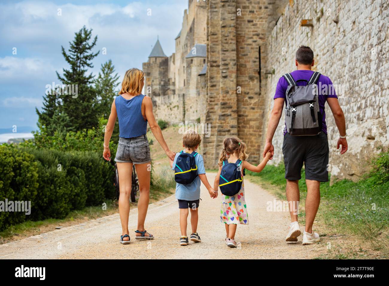 Tourist family with kids enjoy walk along ancient castle walls Stock ...