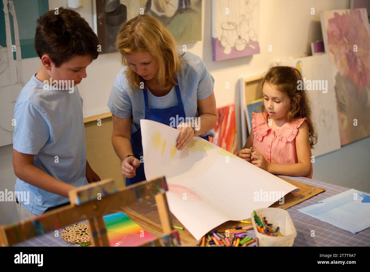 Creative diverse kids during art class in elementary school classroom ...