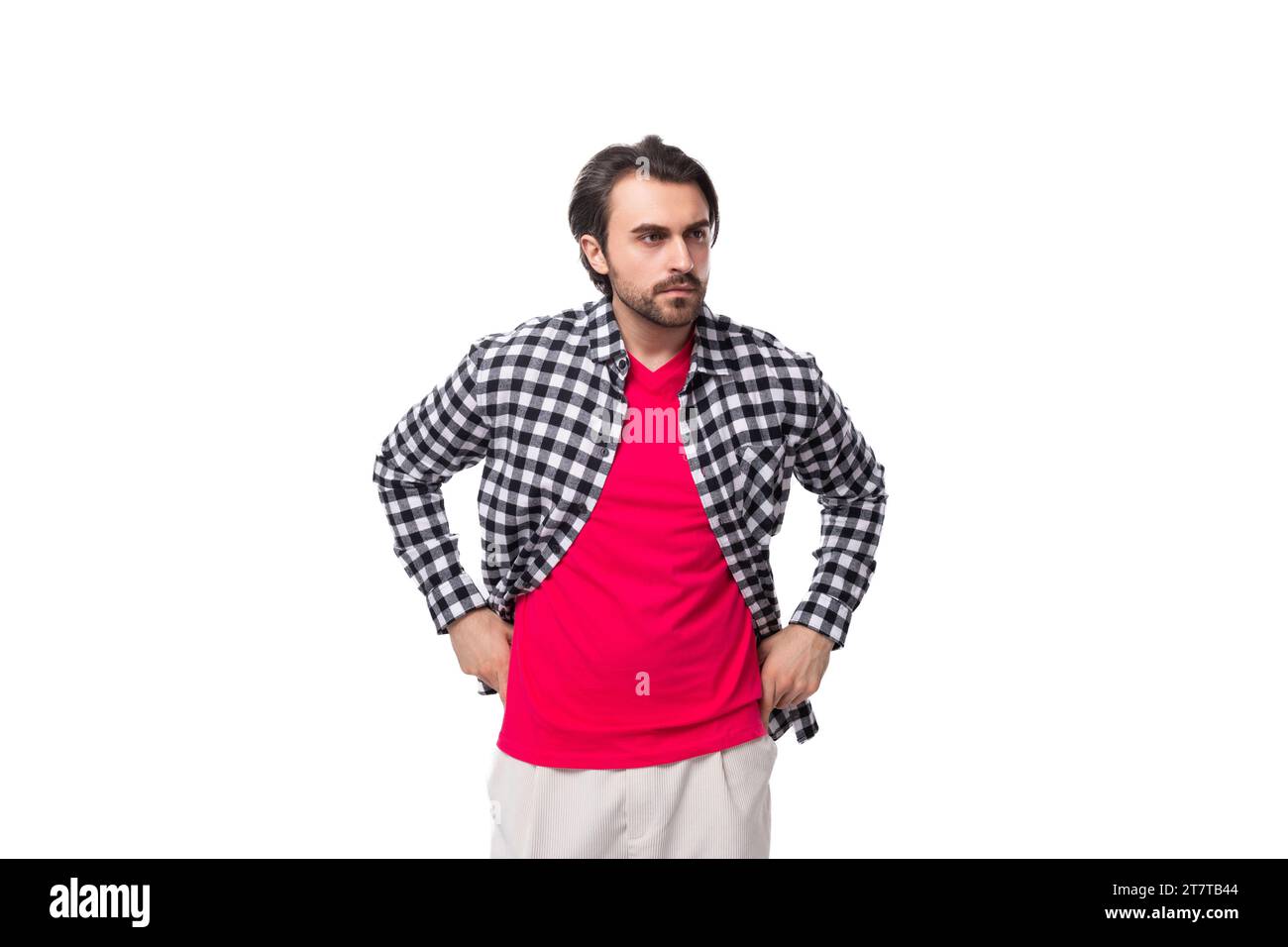 young european man with black hair and unshaven beard in a shirt on a ...