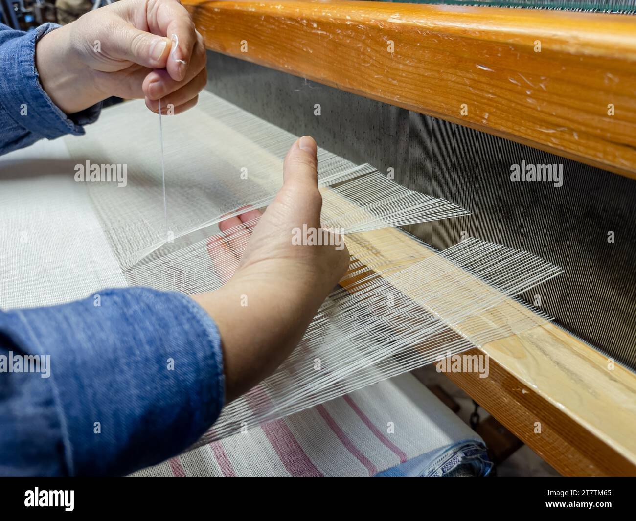 Traditional textile manufacture Weaving thread for the textile industry ...