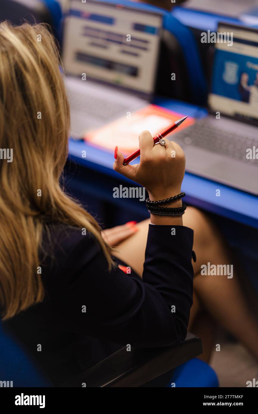 A diverse group of university students collaborating indoors on a ...