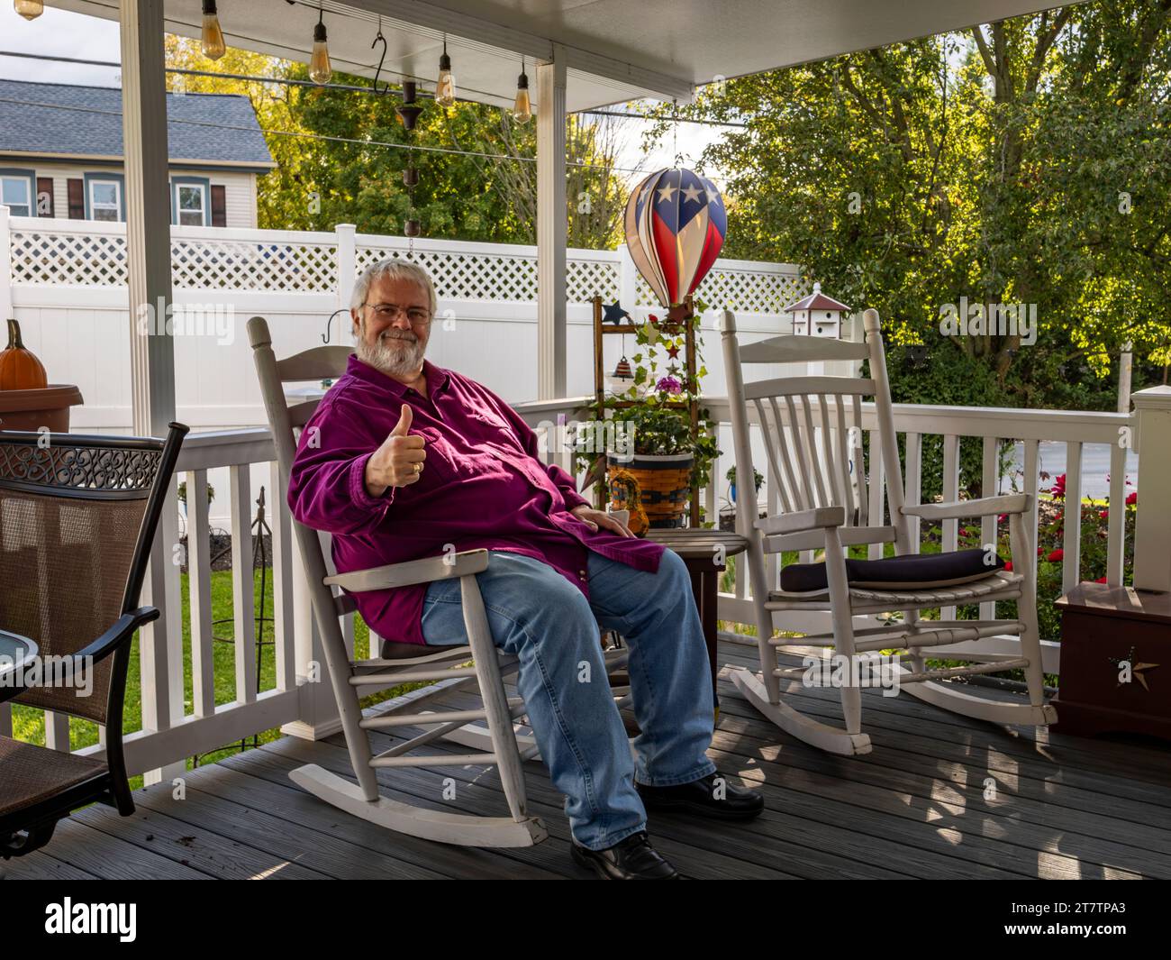 Senior Aged Male Resting in a Rocking Chair, on a Deck, Enjoying His ...