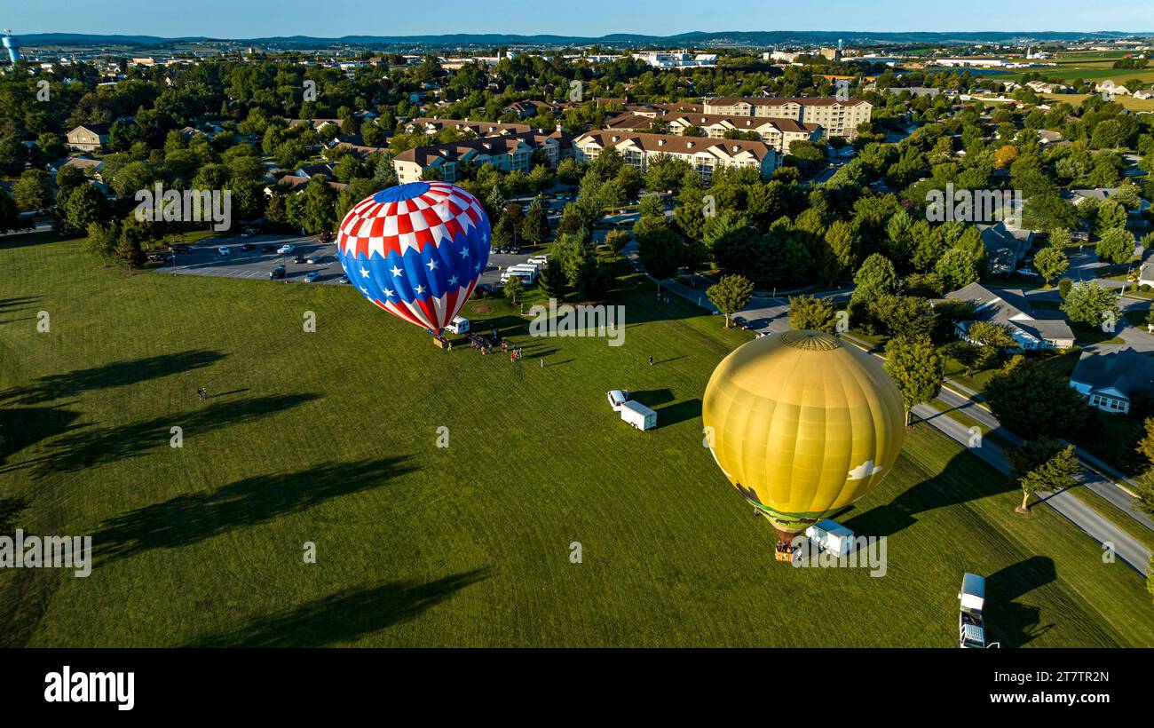 An Aerial View of Two Hot Air Balloons Setting Up to Launch on a Field ...