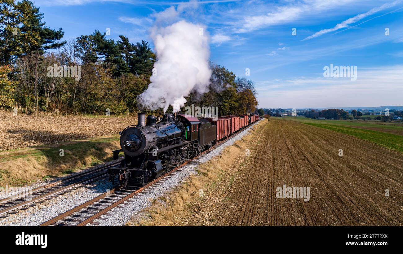 An Aerial View of an Antique Steam Freight Passenger Train Blowing ...