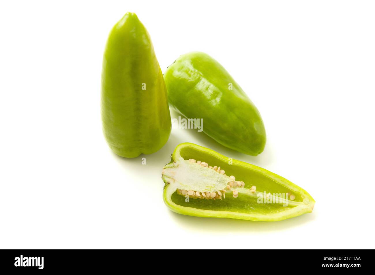 Two whole and half of green bell pepper (capsicum) known as sweet bell ...