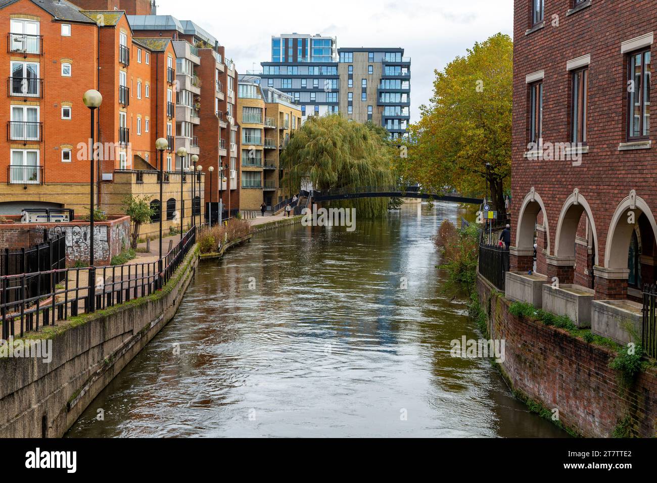 River Kennet flowing past apartment housing in town centre, view east ...