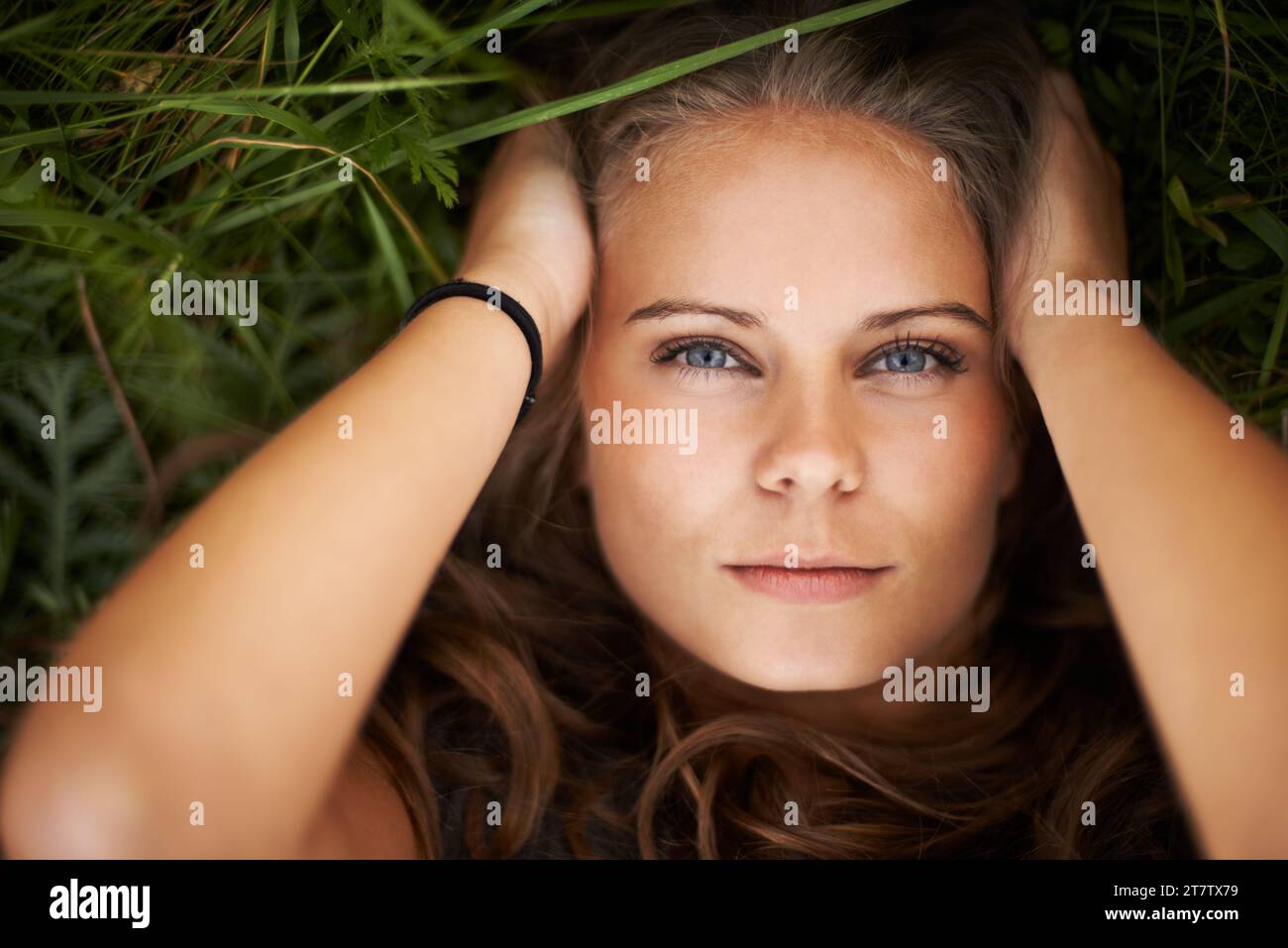 Portrait, above and beauty of woman on grass outdoor, healthy skin and ...