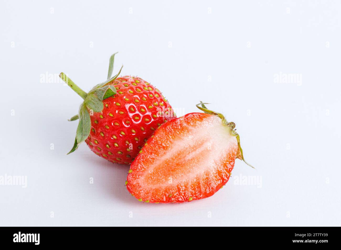 Strawberry isolated. Whole, half, cut strawberry on white. Side view ...