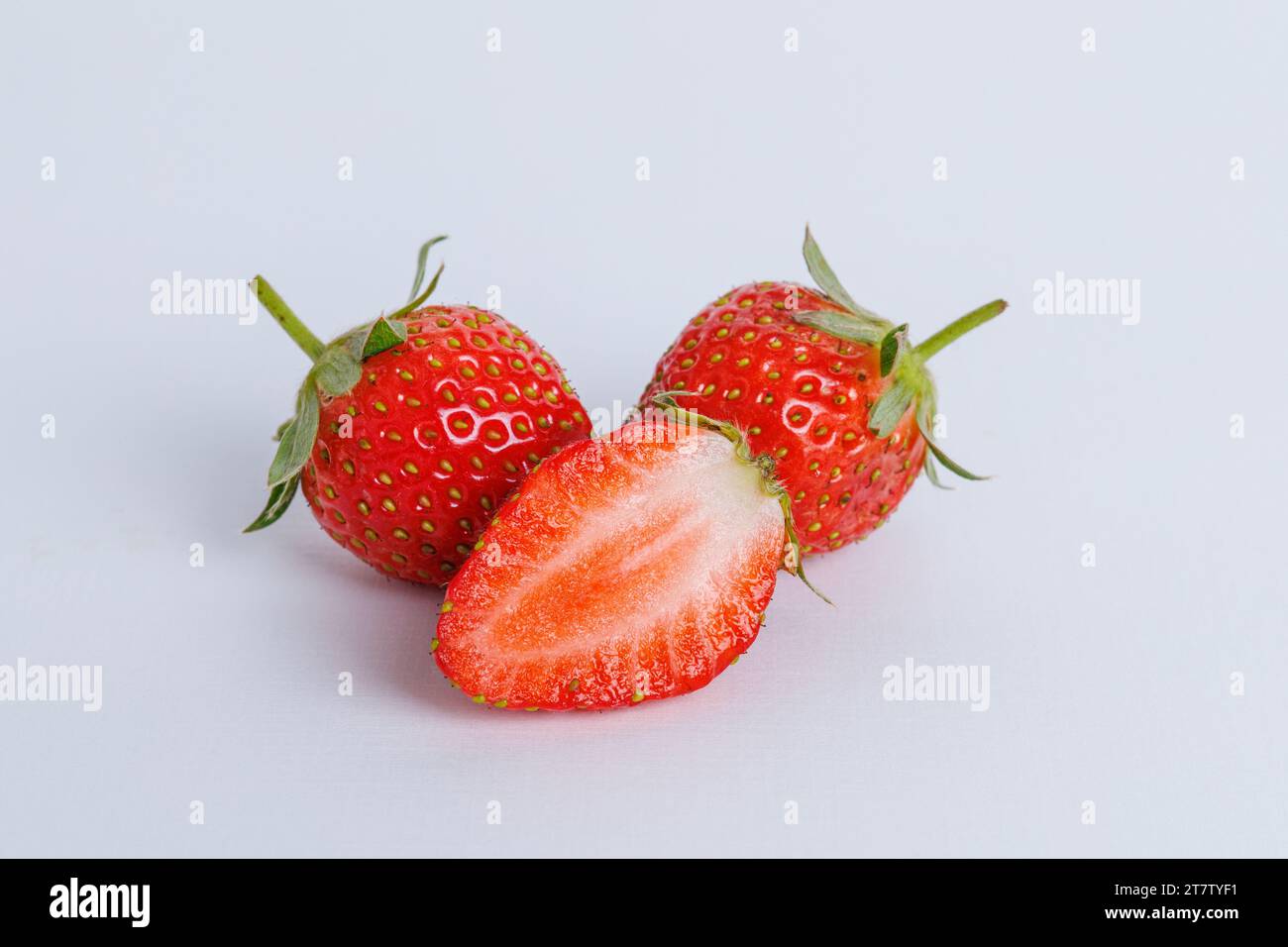 Strawberry isolated. Whole, half, cut strawberry on white. Side view ...