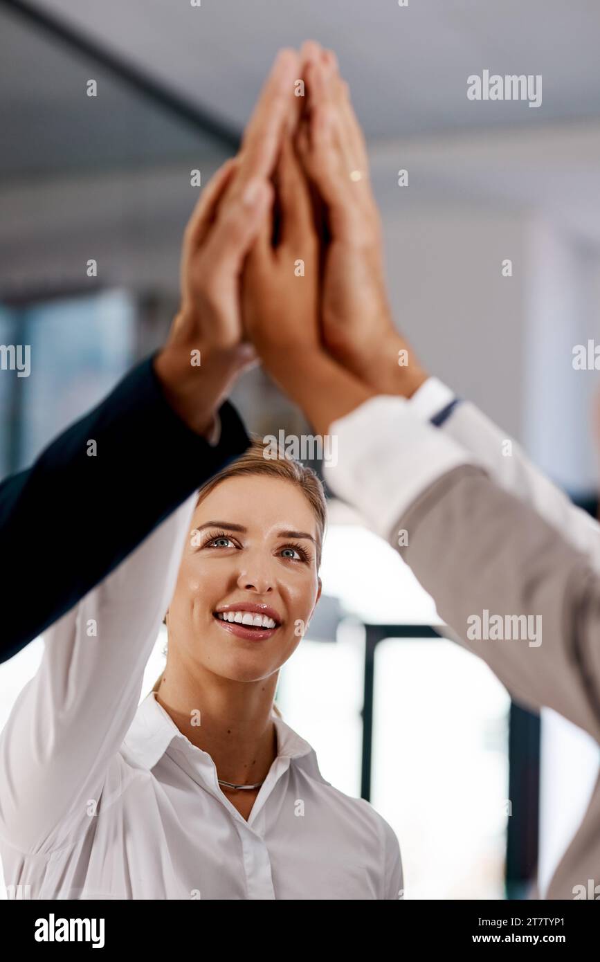 Female workers celebrating high five hi-res stock photography and ...