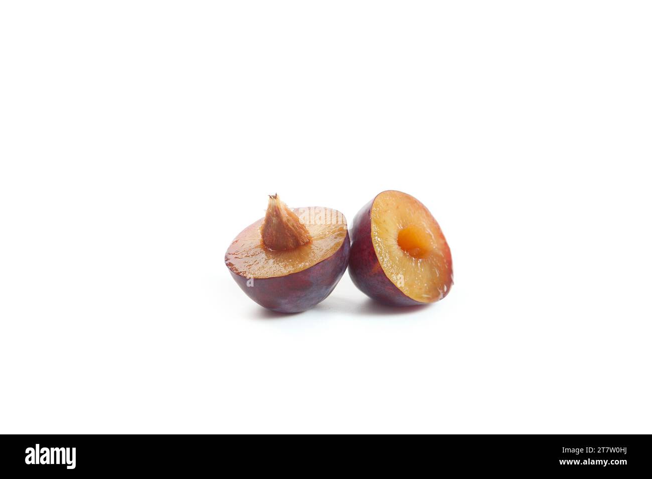 Juicy summer plum fruit. Halves ripe sweet plum isolated on white ...