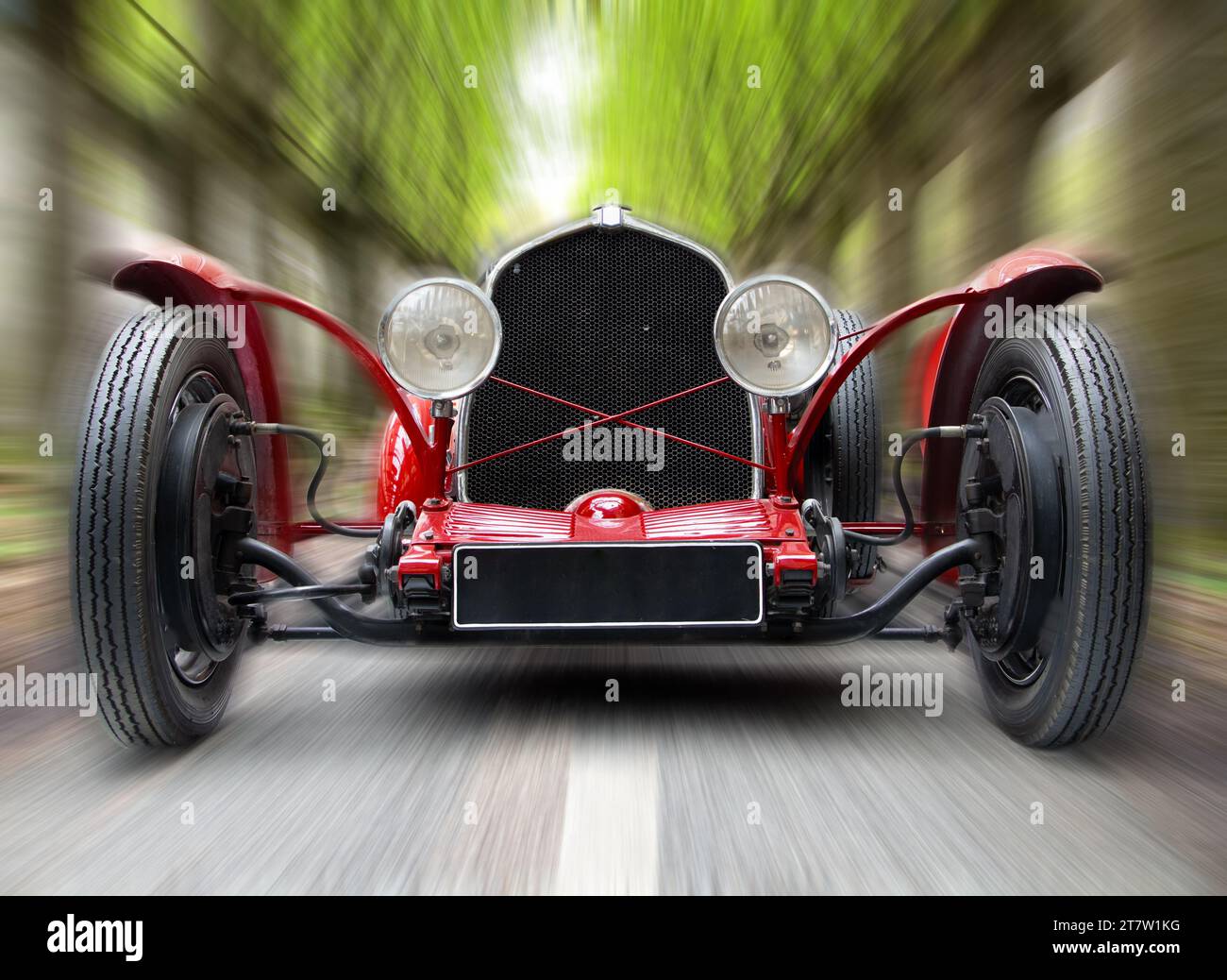 An old car is driving fast on a country road with an alley Stock Photo ...