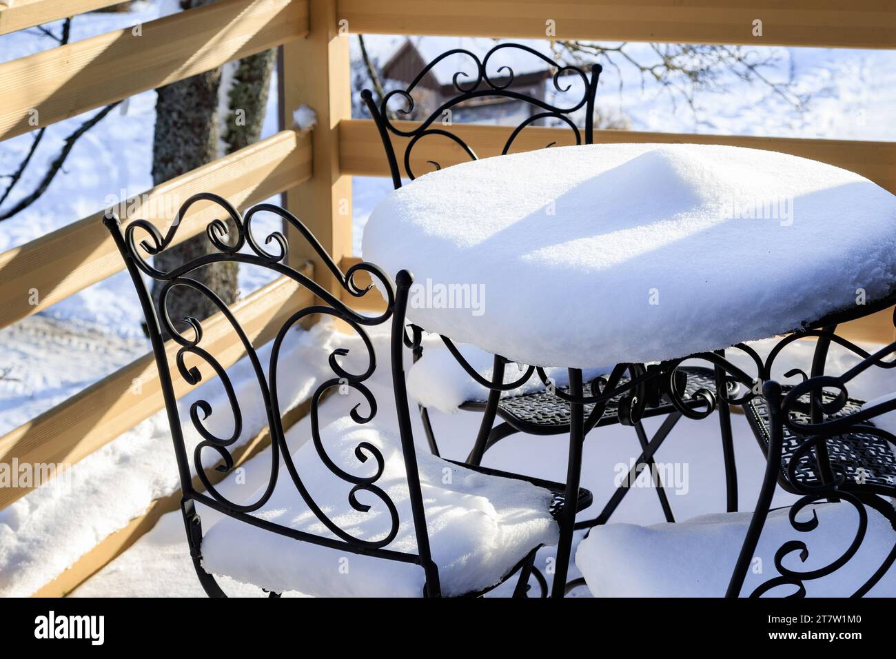 Outdoor table and chairs covered in snow after the first snowfall Stock ...