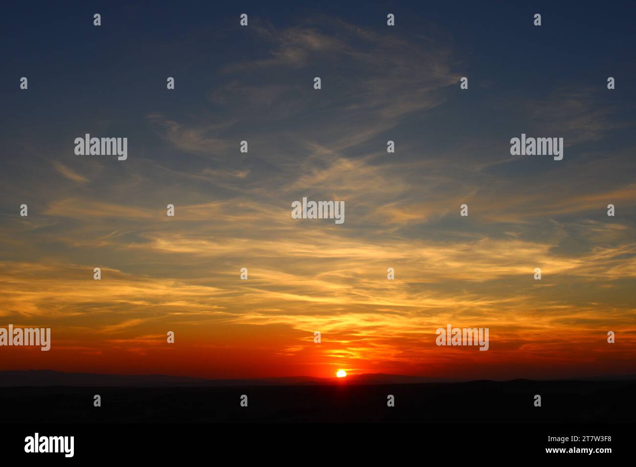 Cumulus clouds and different color tones in the sky at sunset. Amazing ...
