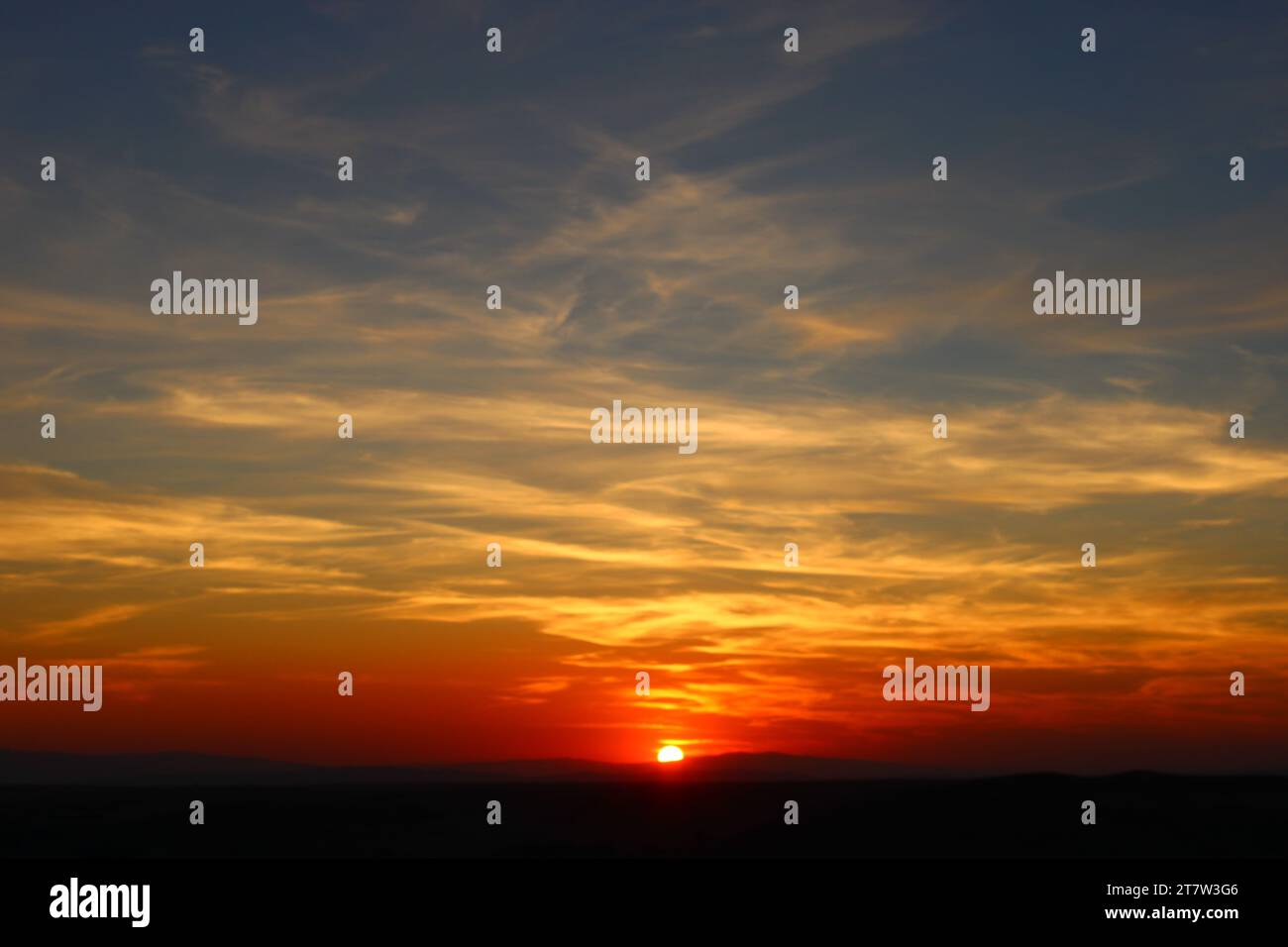 Cumulus clouds and different color tones in the sky at sunset. Amazing ...
